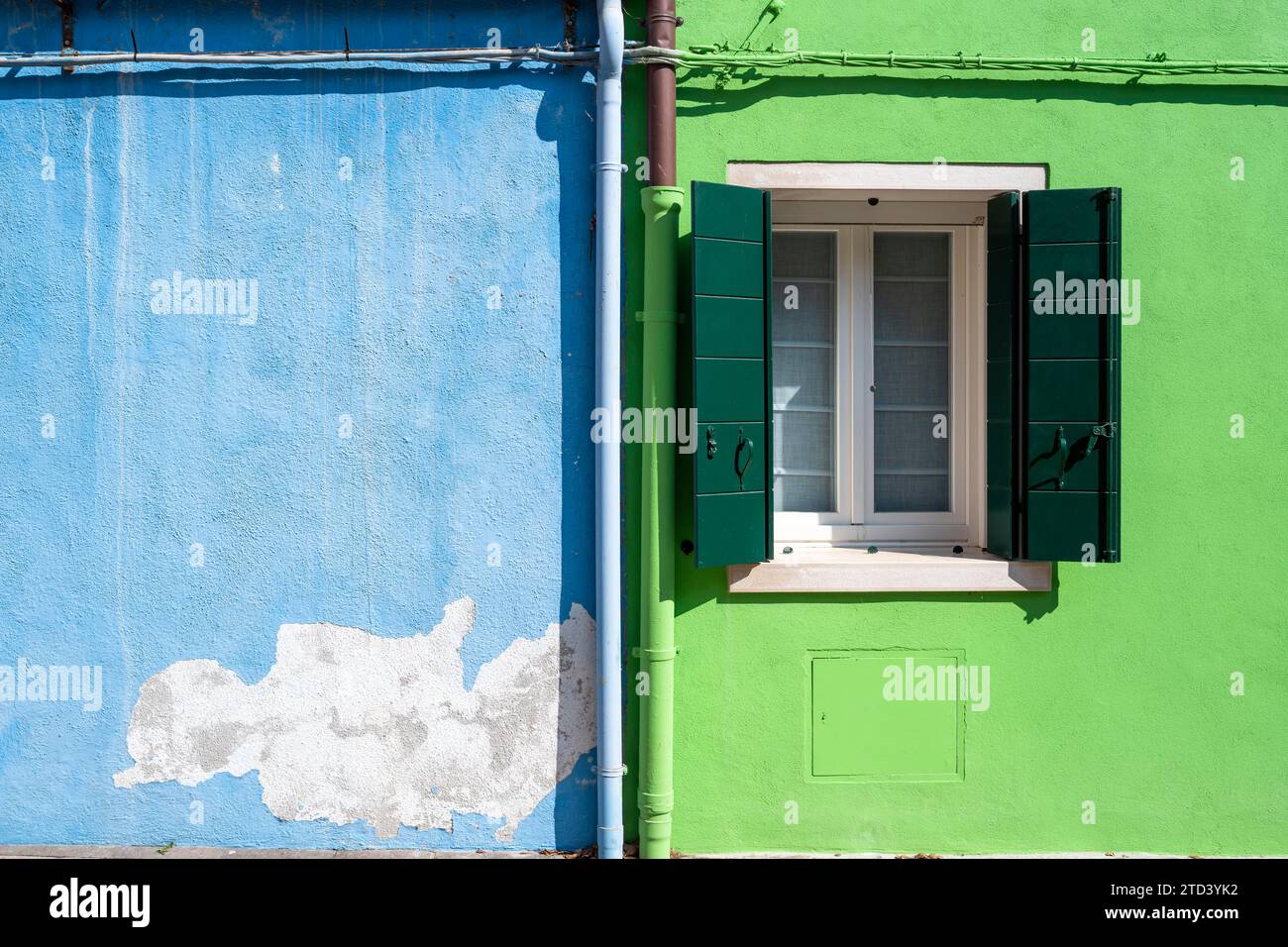 Blue and green house facade with window, colourful houses on the island ...