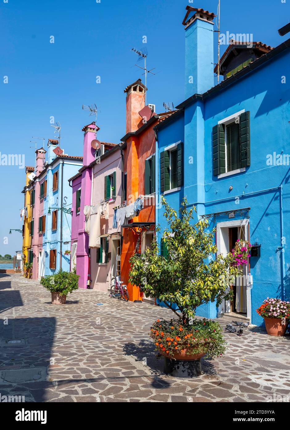 Colourful houses with flowers, colourful house facades, alleys on the ...