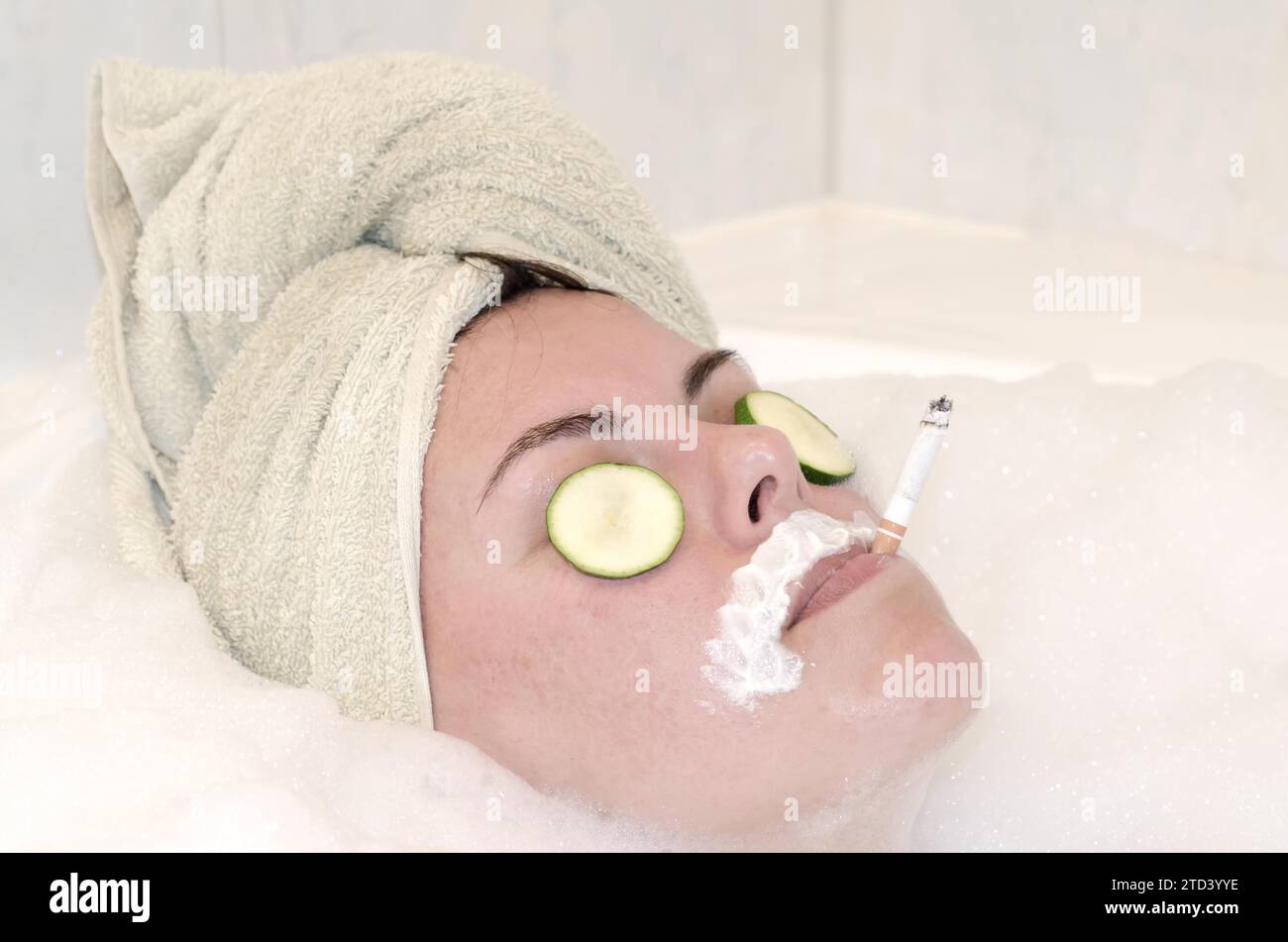 Headshot on a Woman Relaxing in the Bathtub with a Towel on Her Head ...
