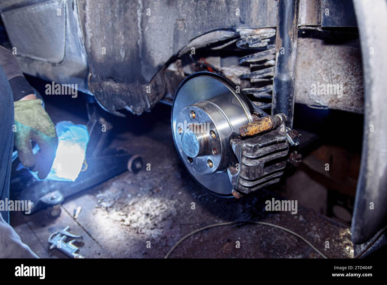 Installing a new brake disc on a car hub Stock Photo - Alamy