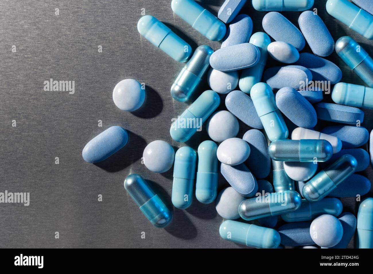Blue pills and tablets, medication background Stock Photo - Alamy