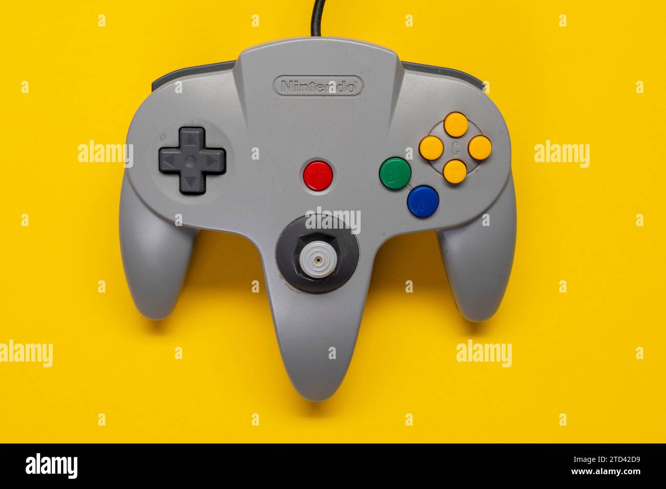 Controller Nintendo 64 Game Console In Front Of Monochrome Yellow