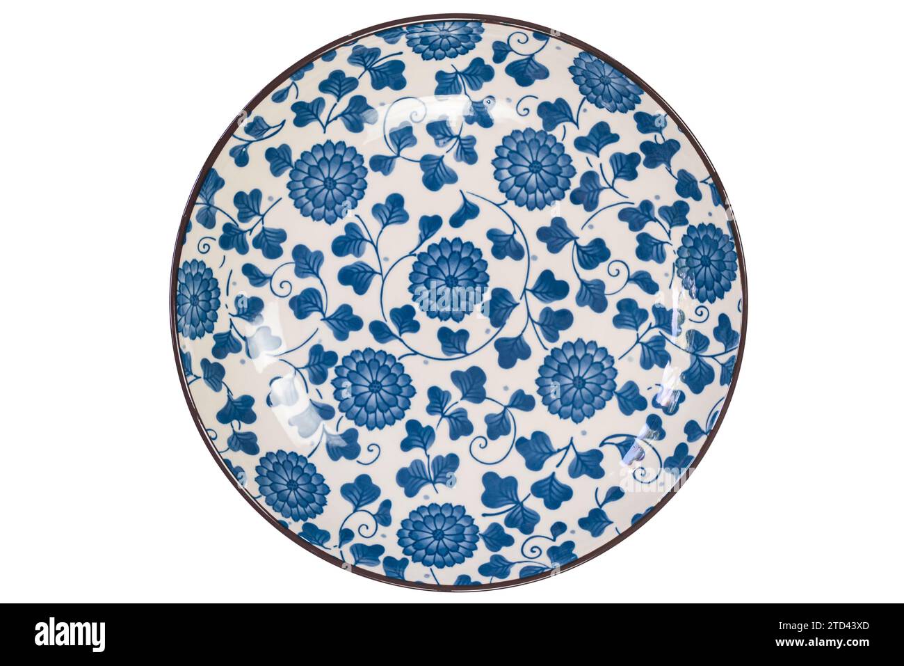 Top view of blue flowers pattern ceramic plate with black edge isolated ...