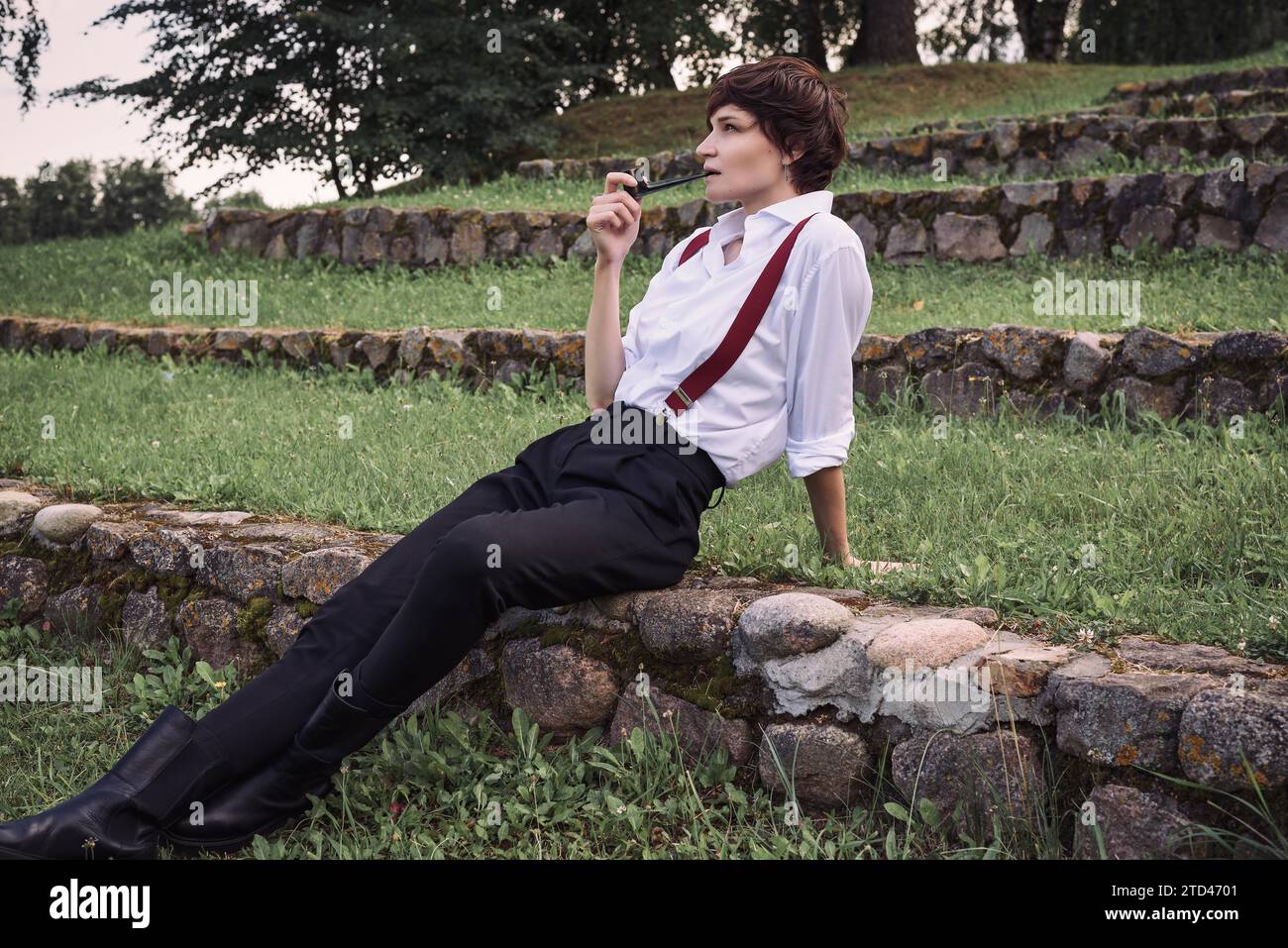 Image of a stylish beautiful woman in a white shirt, black trousers and ...