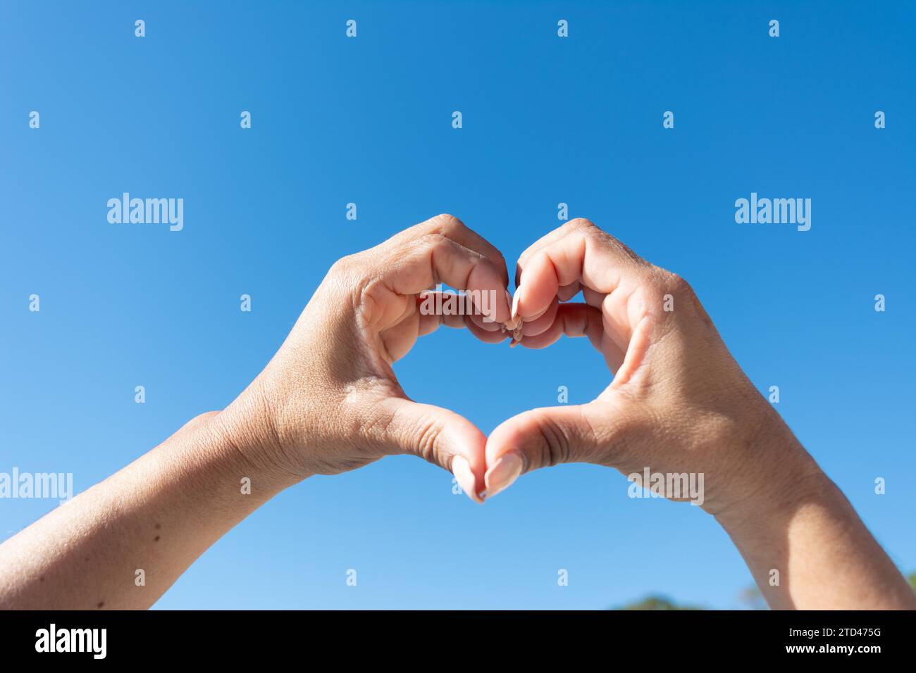 Hand showing sign heart hi-res stock photography and images - Alamy