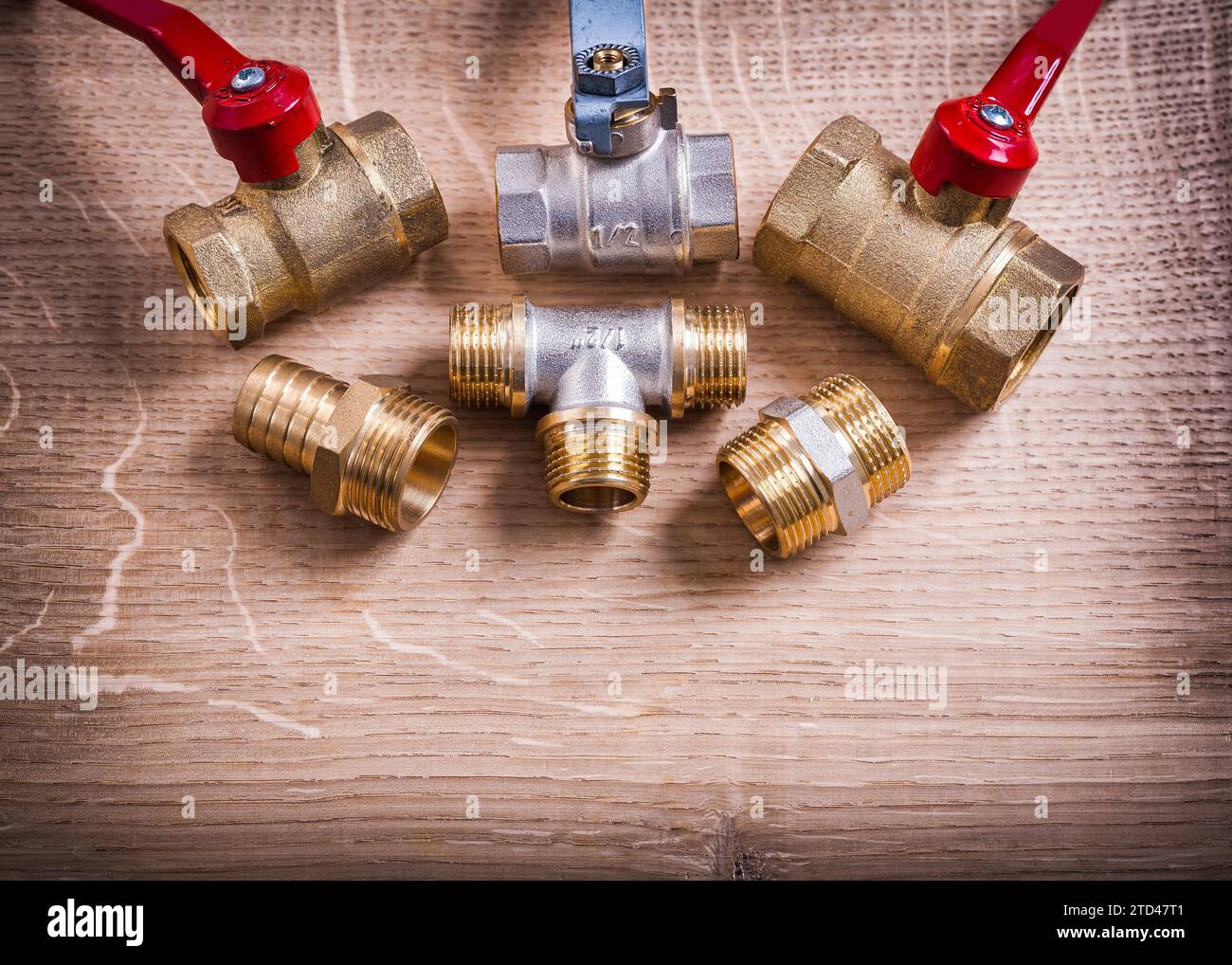 Group of pipe connectors and fittings on wooden board Stock Photo - Alamy