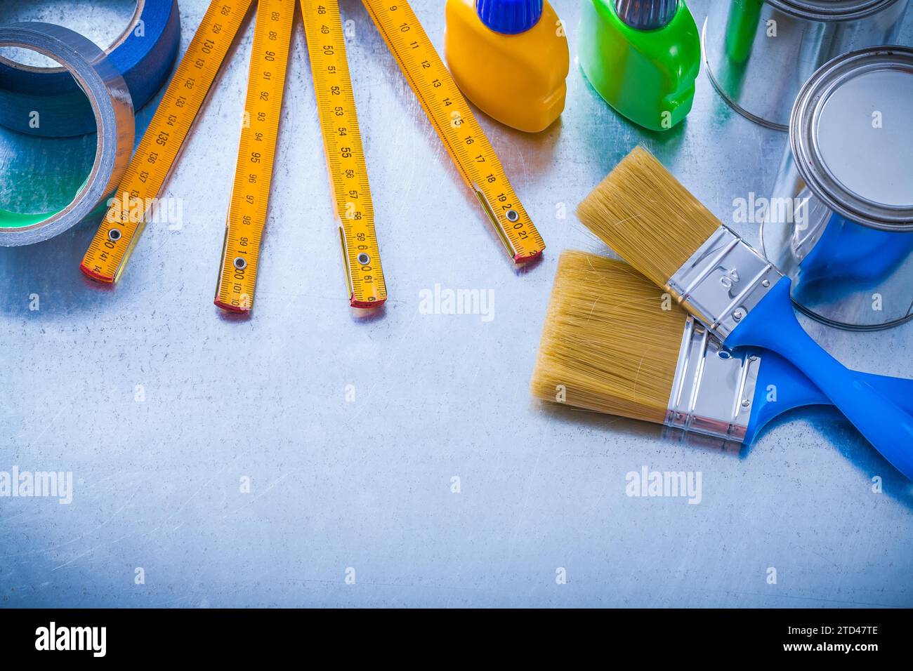 Group of coloured objects with adhesive tapes and wooden counters on a ...