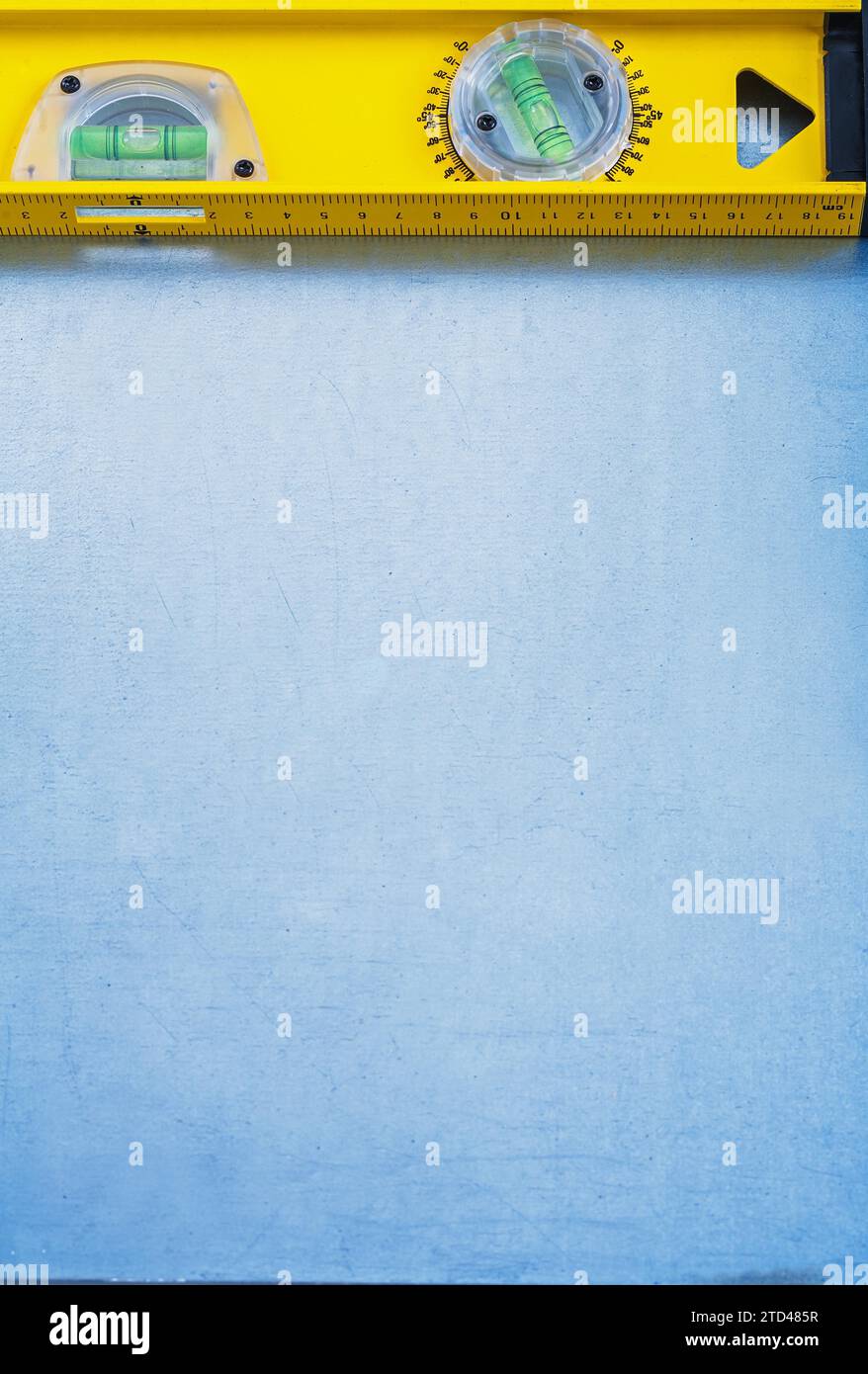 Copyspace image of the construction level on a metallic background ...