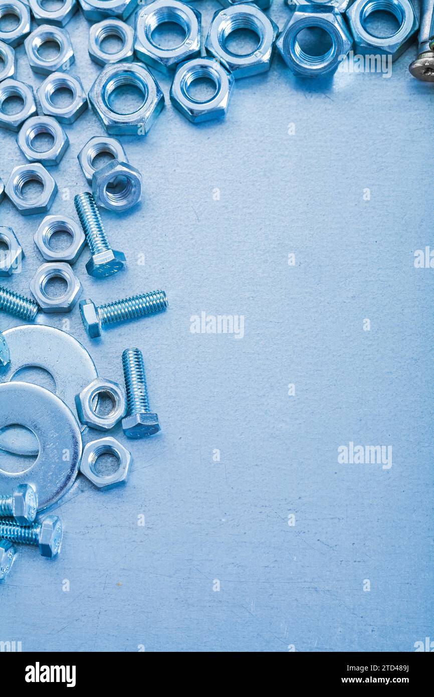 Metallic background with stainless steel bolts, washers and nuts Repair ...