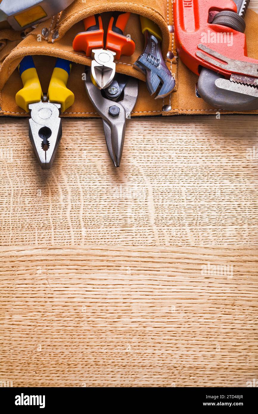 Monkey and adjustable spanner pliers steel pliers in tool belt on ...