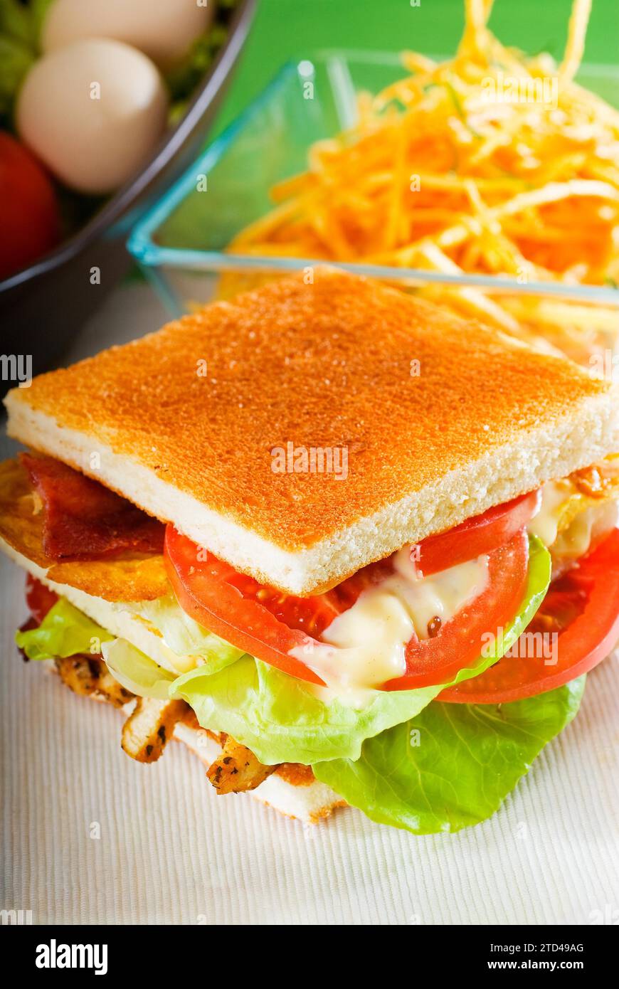 Fresh and delicious classic club sandwich over a transparent glass dish ...