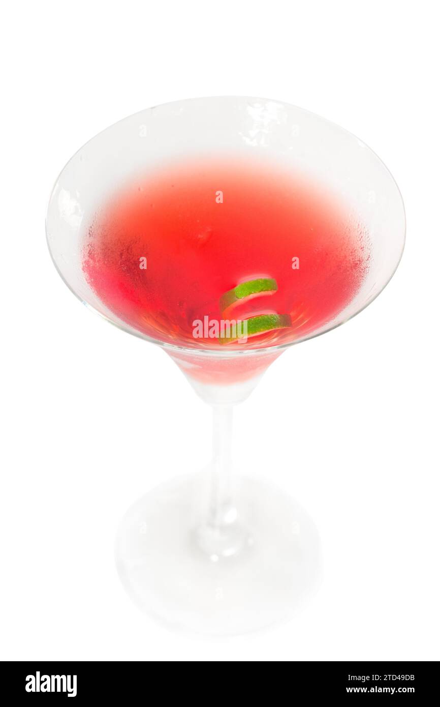 Cosmopolitan drink cocktail straight up on martini cup with lime peel ...