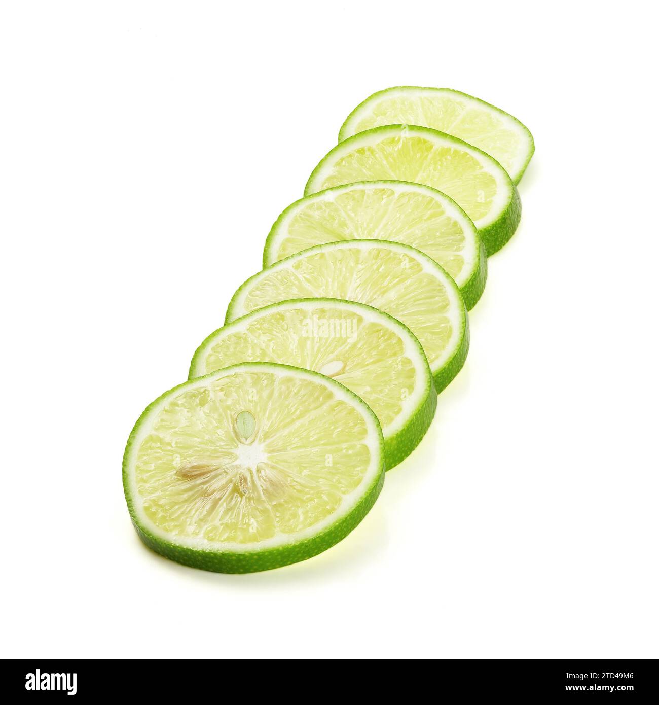 Green fresh lime slices isolated over white background Stock Photo - Alamy
