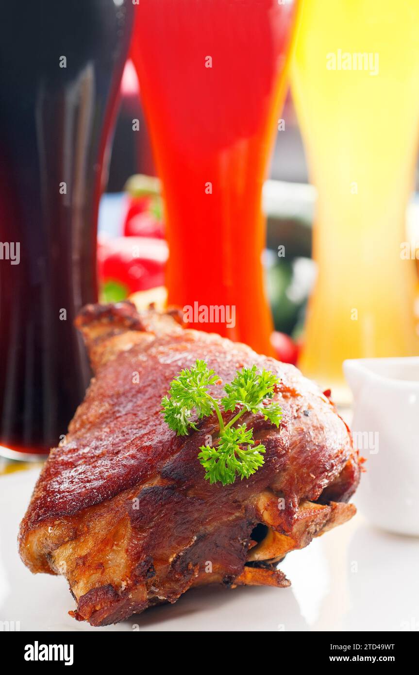 Original German BBQ pork knuckle served with mashed potatoes and ...