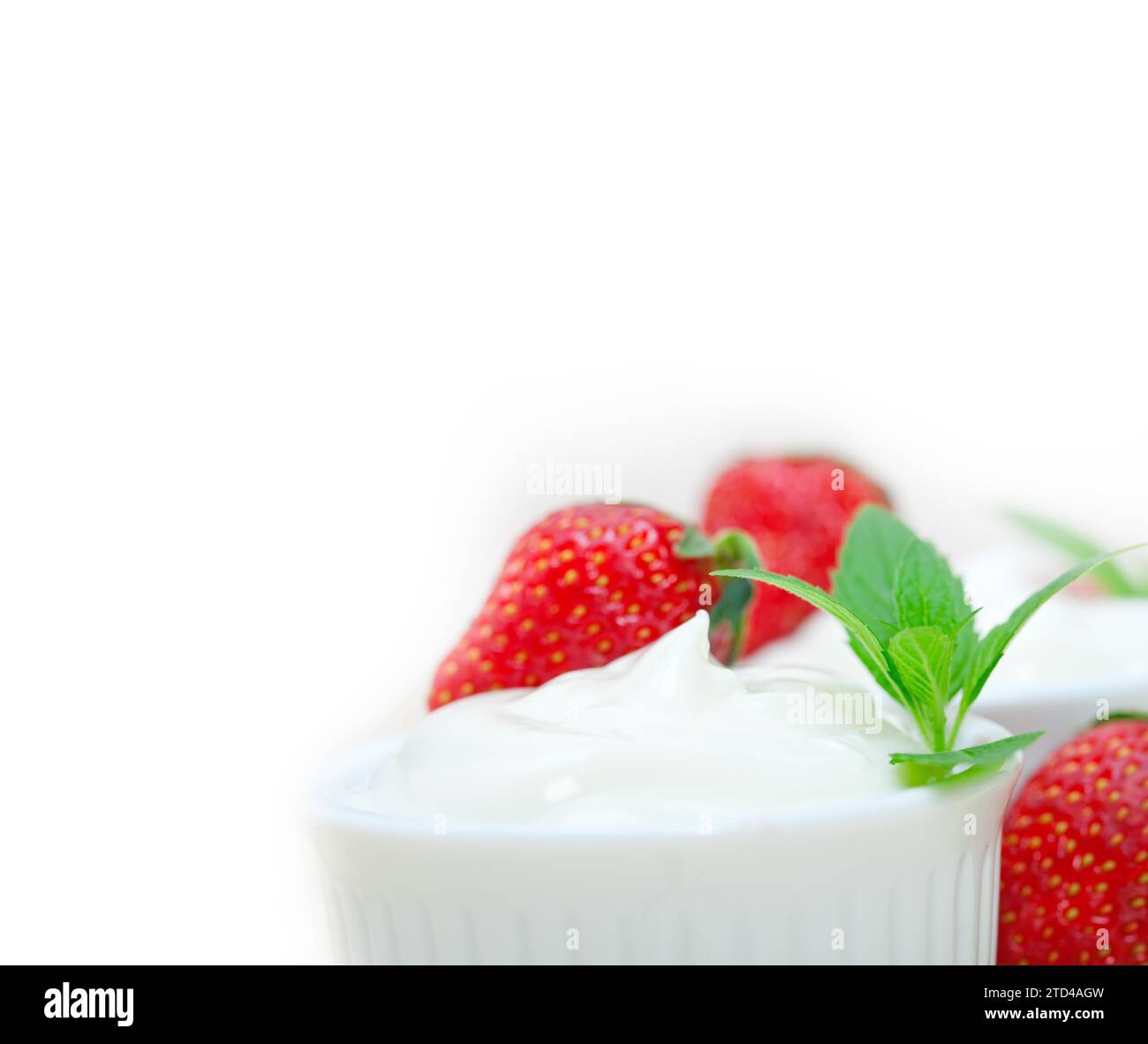 Organic Greek yogurt and strawberry over white rustic wood table Stock ...