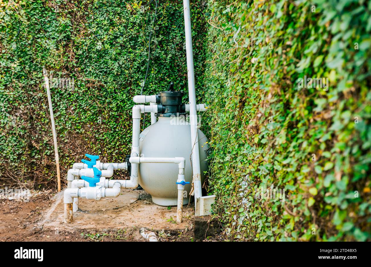 Home swimming pool filter and treatment plant installed. Pool pump with ...