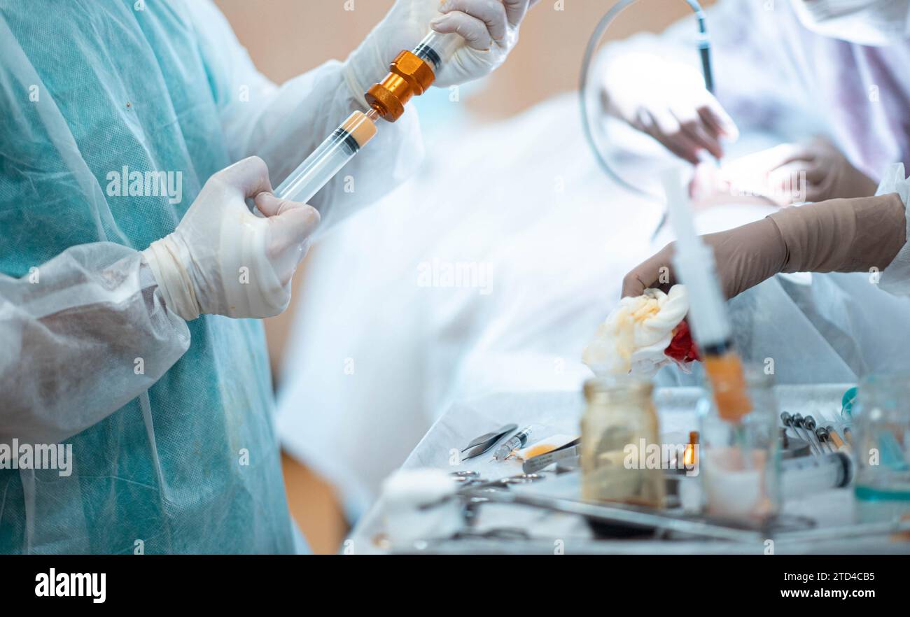 Liposuction and lipofilling concept, surgery in the operating room, fat ...