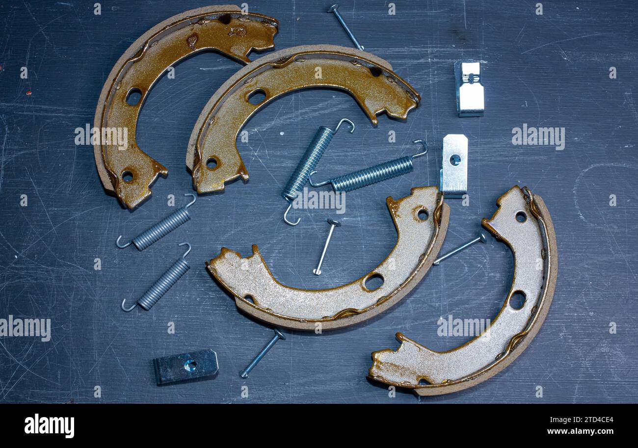 Hand parking brake pad replacement concept, old rusty auto parts are ...