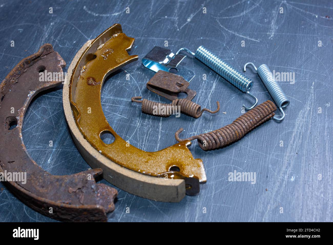 Hand parking brake pad replacement concept, old rusty auto parts are ...
