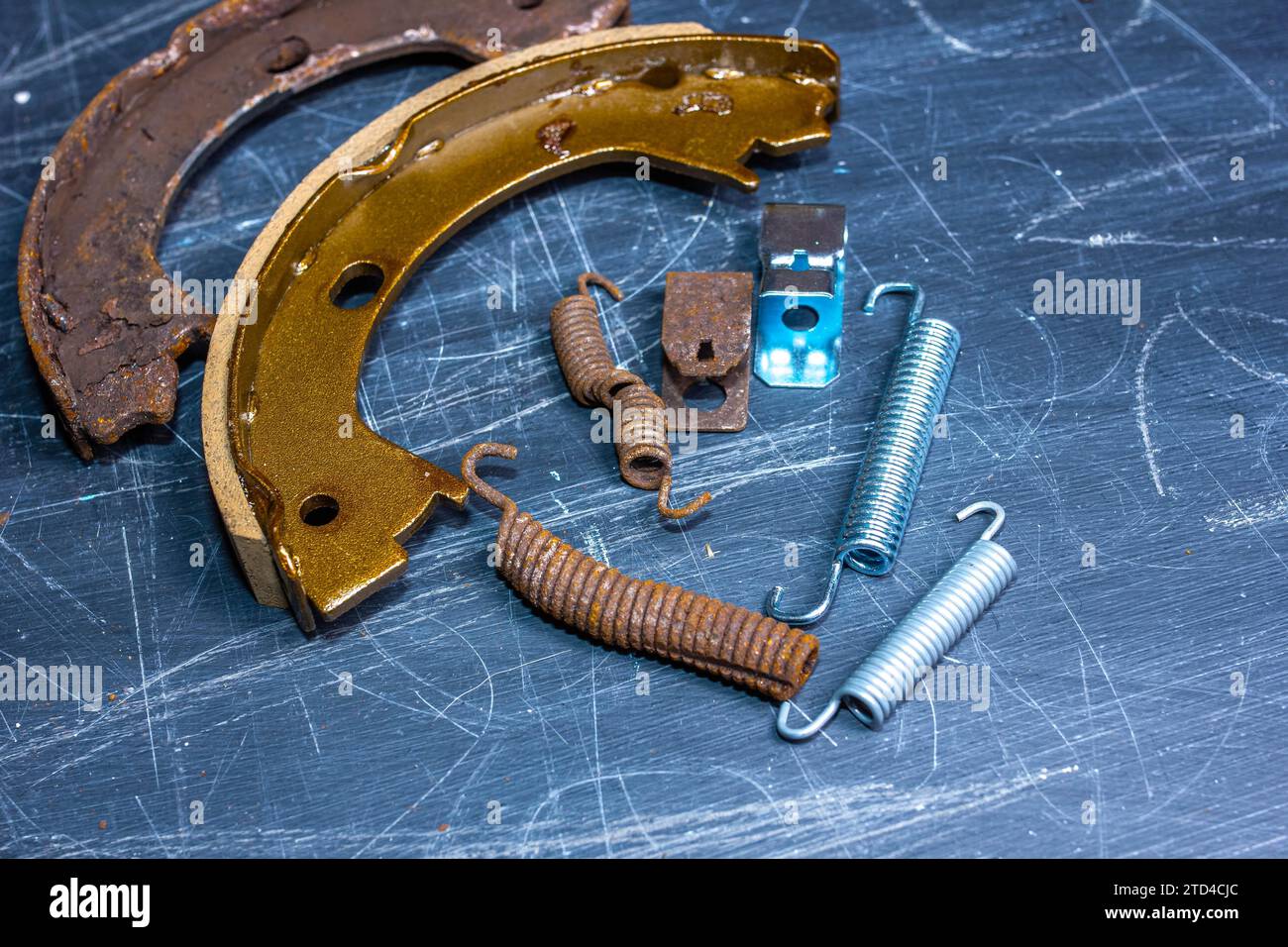 Hand parking brake pad replacement concept, old rusty auto parts are ...