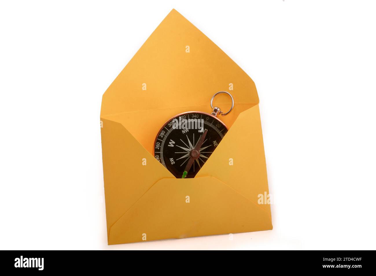 Compass in a an envelope on a white background Stock Photo - Alamy