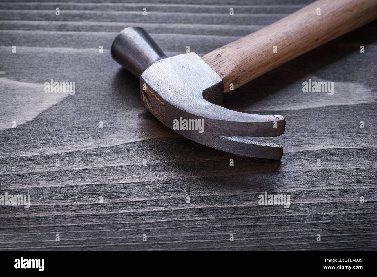 Claw hammer on vintage wooden board Close-up construction concept Stock ...