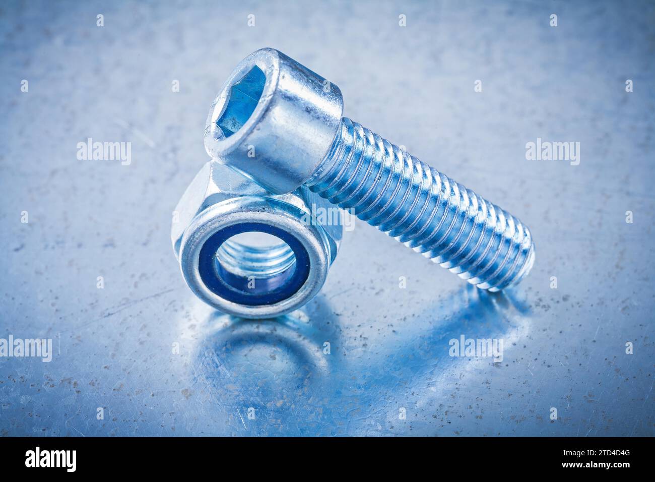 Threaded nut and bolt on metallic background Design concept Stock Photo ...