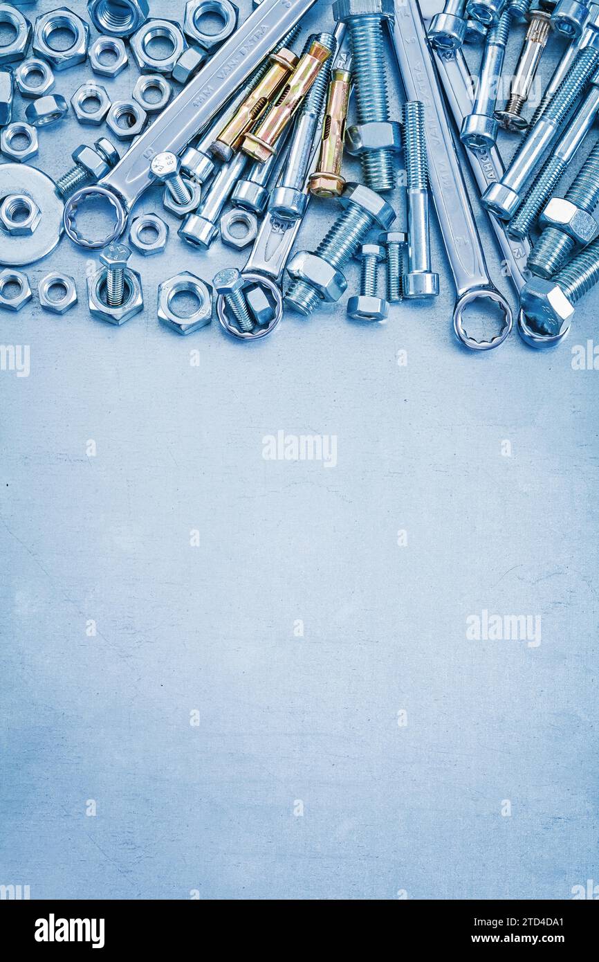 Large set of stainless steel repair tools on metallic background ...