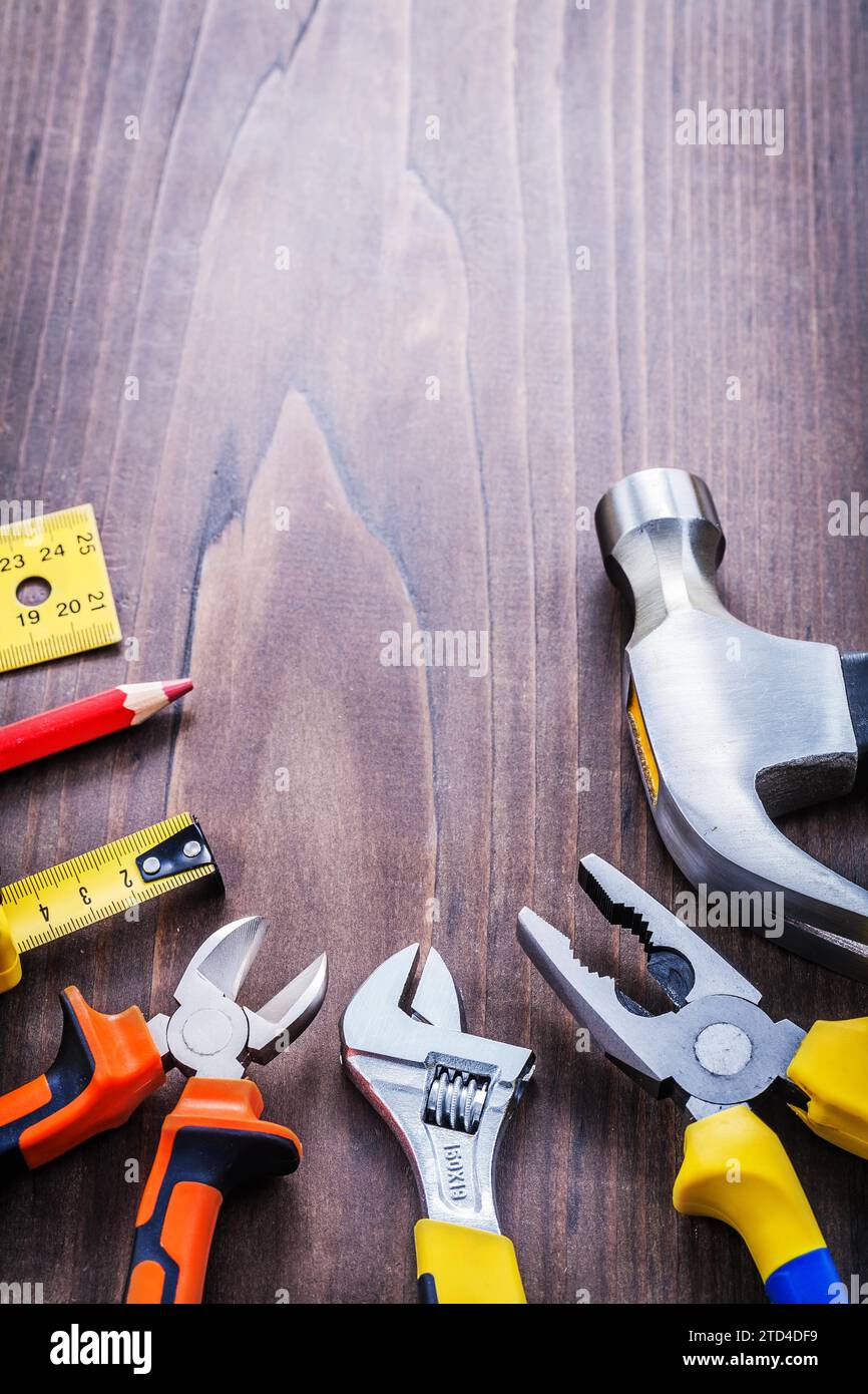 Organised copy room with construction tools ruler pencil tapping pliers ...