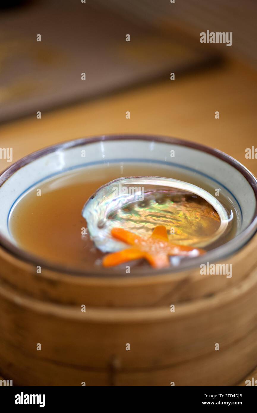 Japanese style abalone soup empty shell on bamboo bowl set holder Stock ...