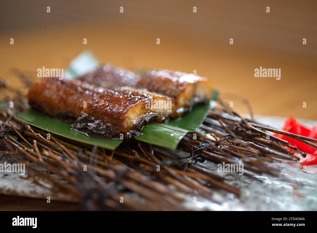 Japanese style roasted eel served on palm leaf Stock Photo - Alamy