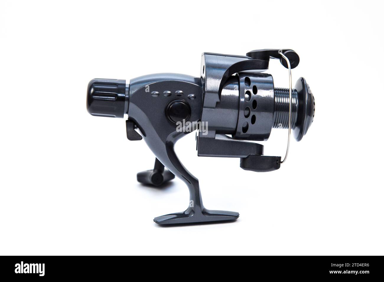 Fishing gear - reel for fishing rod, white background Stock Photo - Alamy