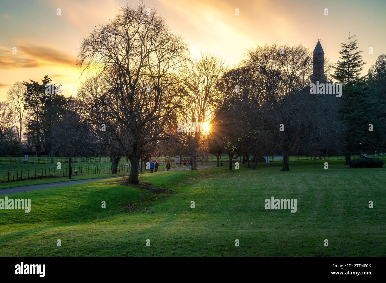People walking and jogging on footpath in Farmleigh Phoenix Park at ...