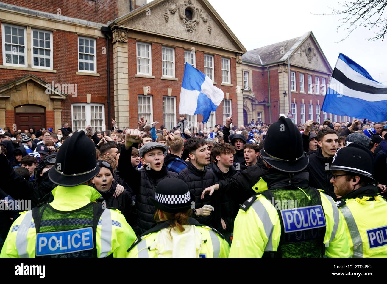 Police keep watch over Ipswich Town fans outside the ground before the ...