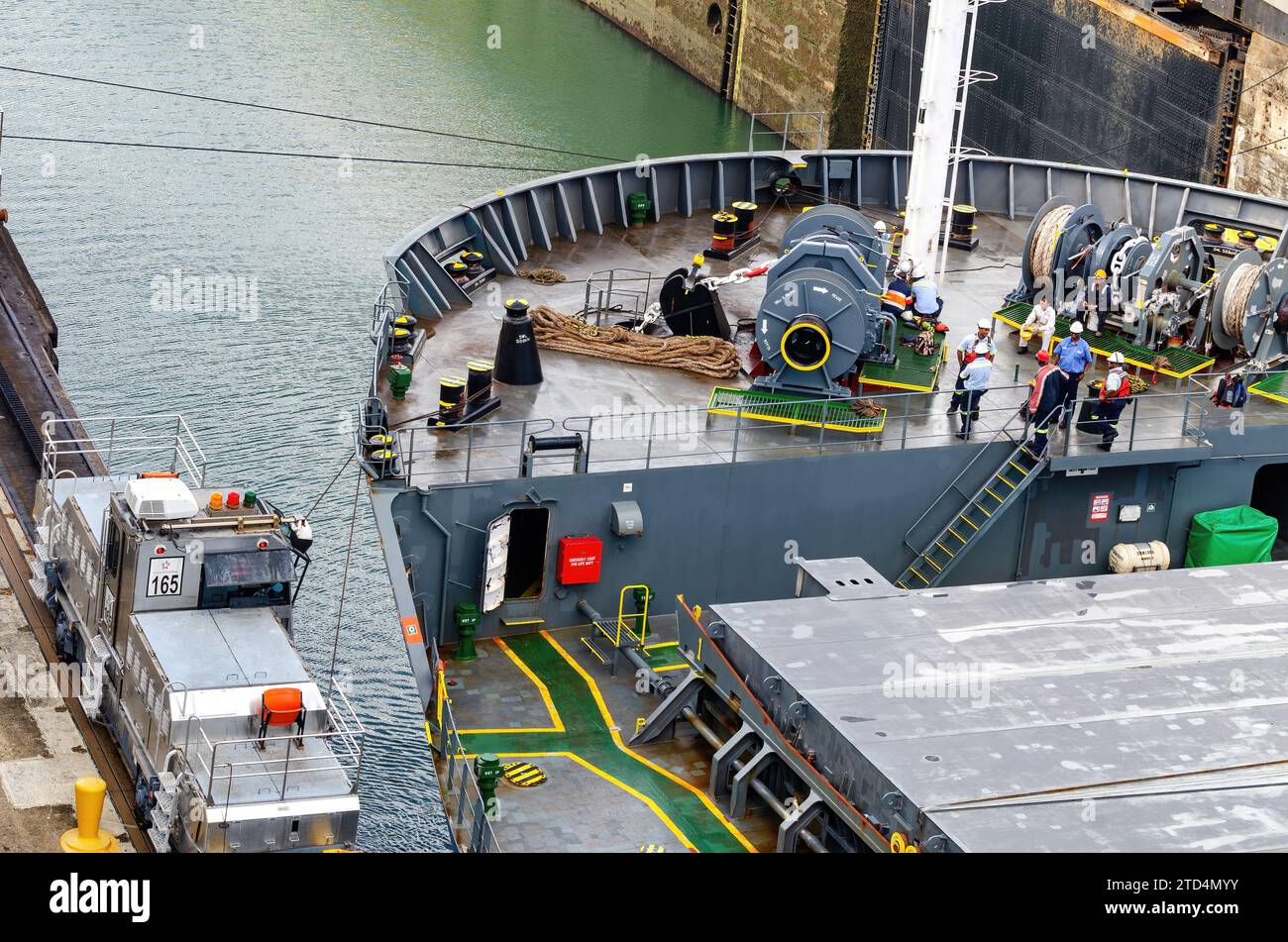 Tankship prow detail with crew at work, entering the Canal locks of ...