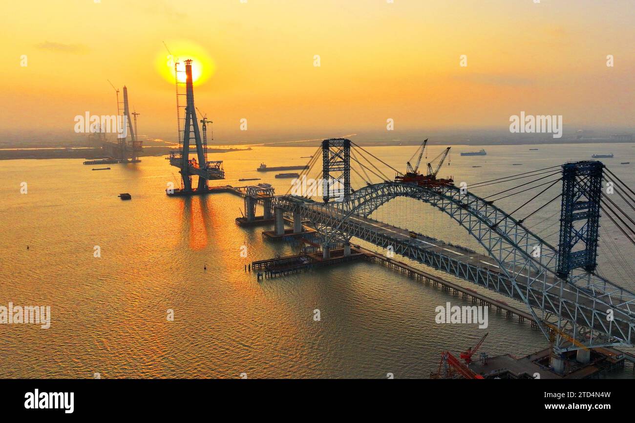 TAIZHOU, CHINA - DECEMBER 16, 2023 - The sunset is reflected over the ...