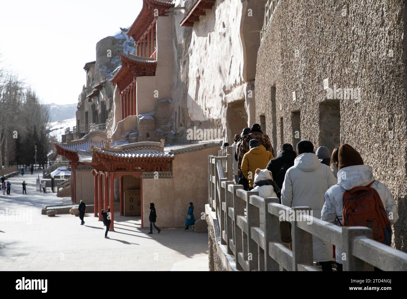 (231216) -- DUNHUANG, Dec. 16, 2023 (Xinhua) -- Tourists visit the ...