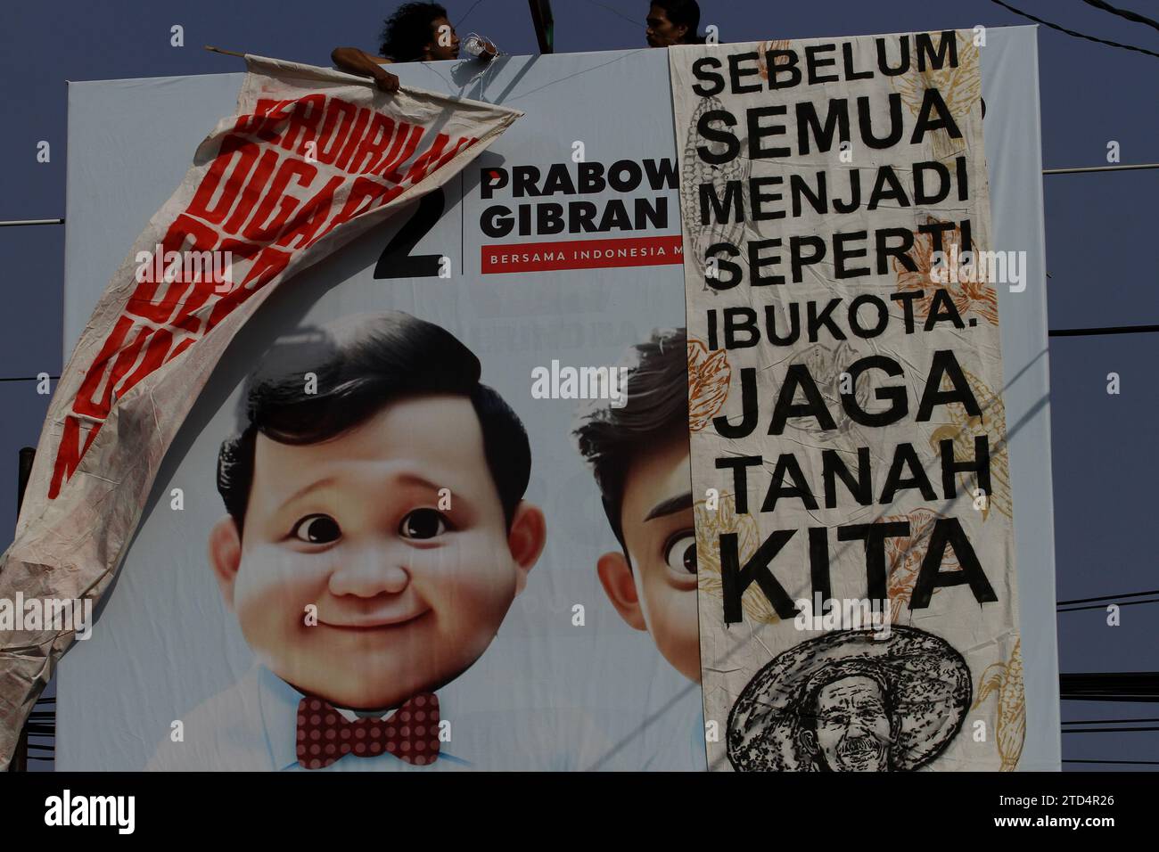 Yogyakarta, Indonesia. 16th Dec 2023. Demonstrators put up giant ...