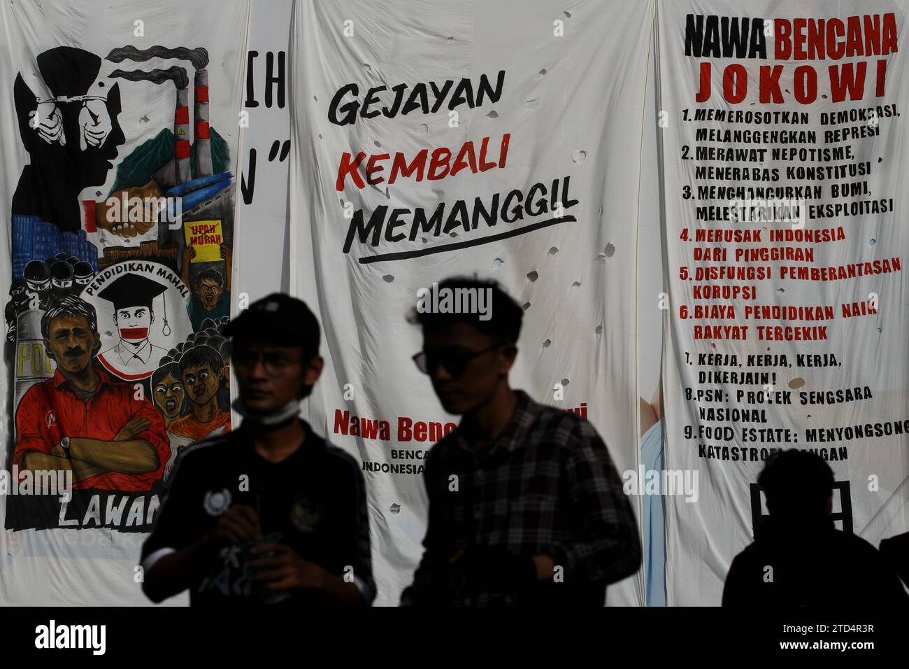 Yogyakarta, Indonesia. 16th Dec 2023. Two men stands in front of giant ...