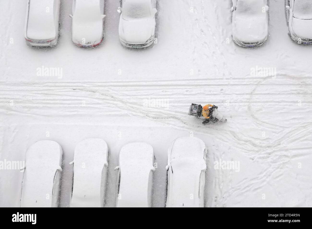 YANTAI, CHINA - DECEMBER 16, 2023 - A food delivery rider delivers food ...