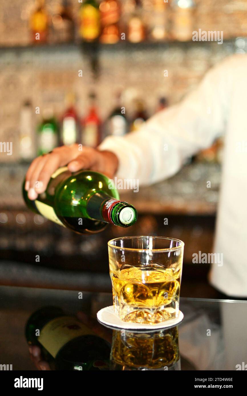 Pouring whiskey in nice hi-res stock photography and images - Alamy