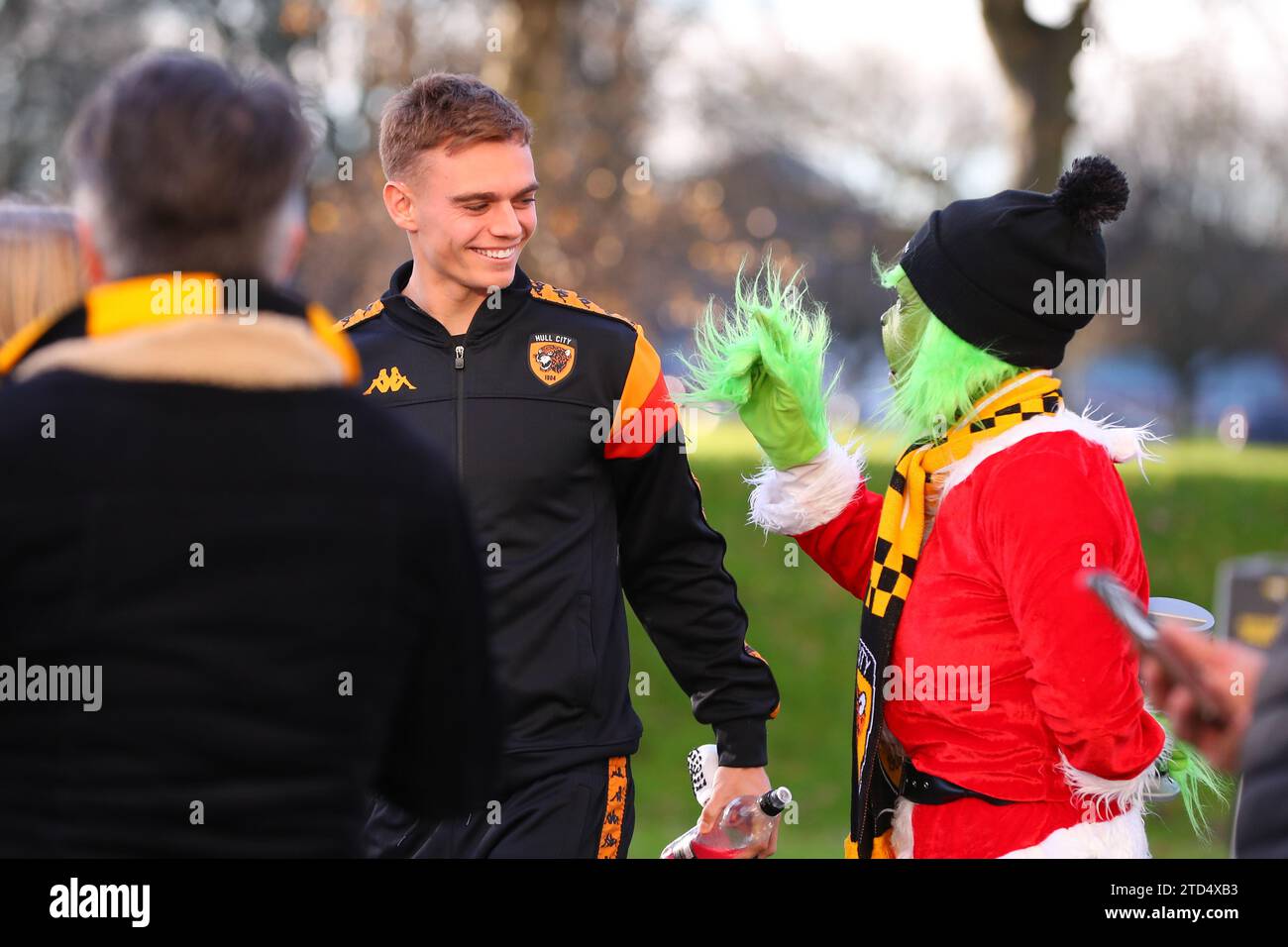 Scott Twine of Hull City meets with a Hull City fan dressed as The ...