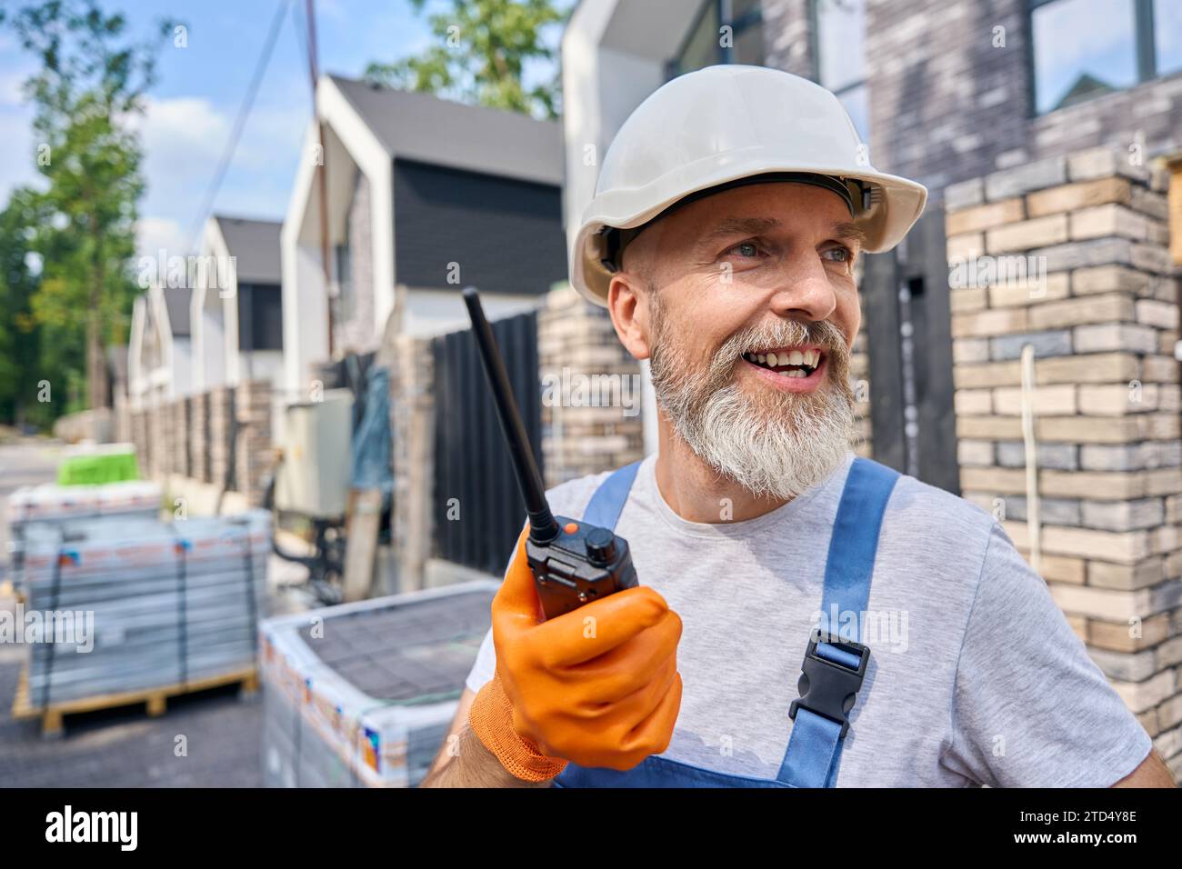 Construction foreman using radio telecommunication hi-res stock ...