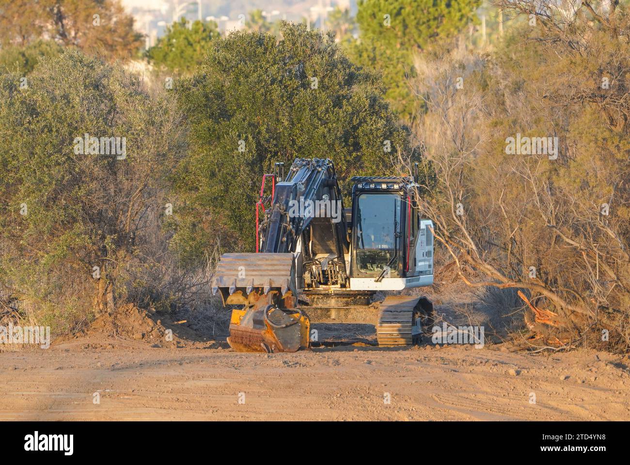 Bulldozer at Guadalhorce natural reserve park, improving lagoon borders ...