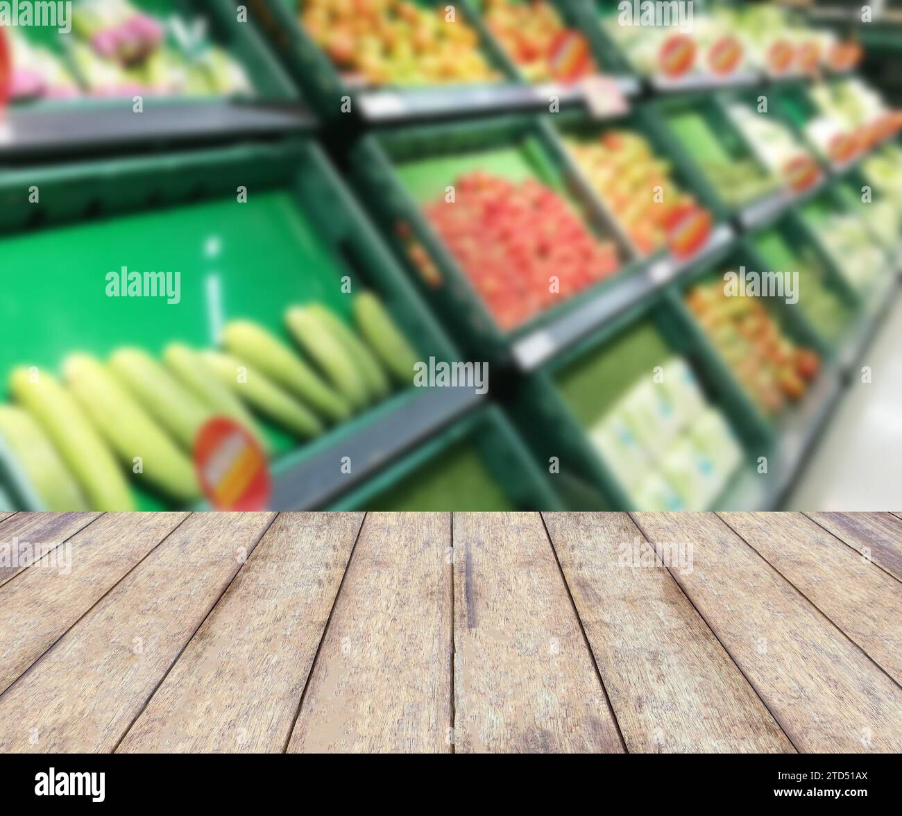 wood counter product display with Vegetables at a supermarket blurred ...