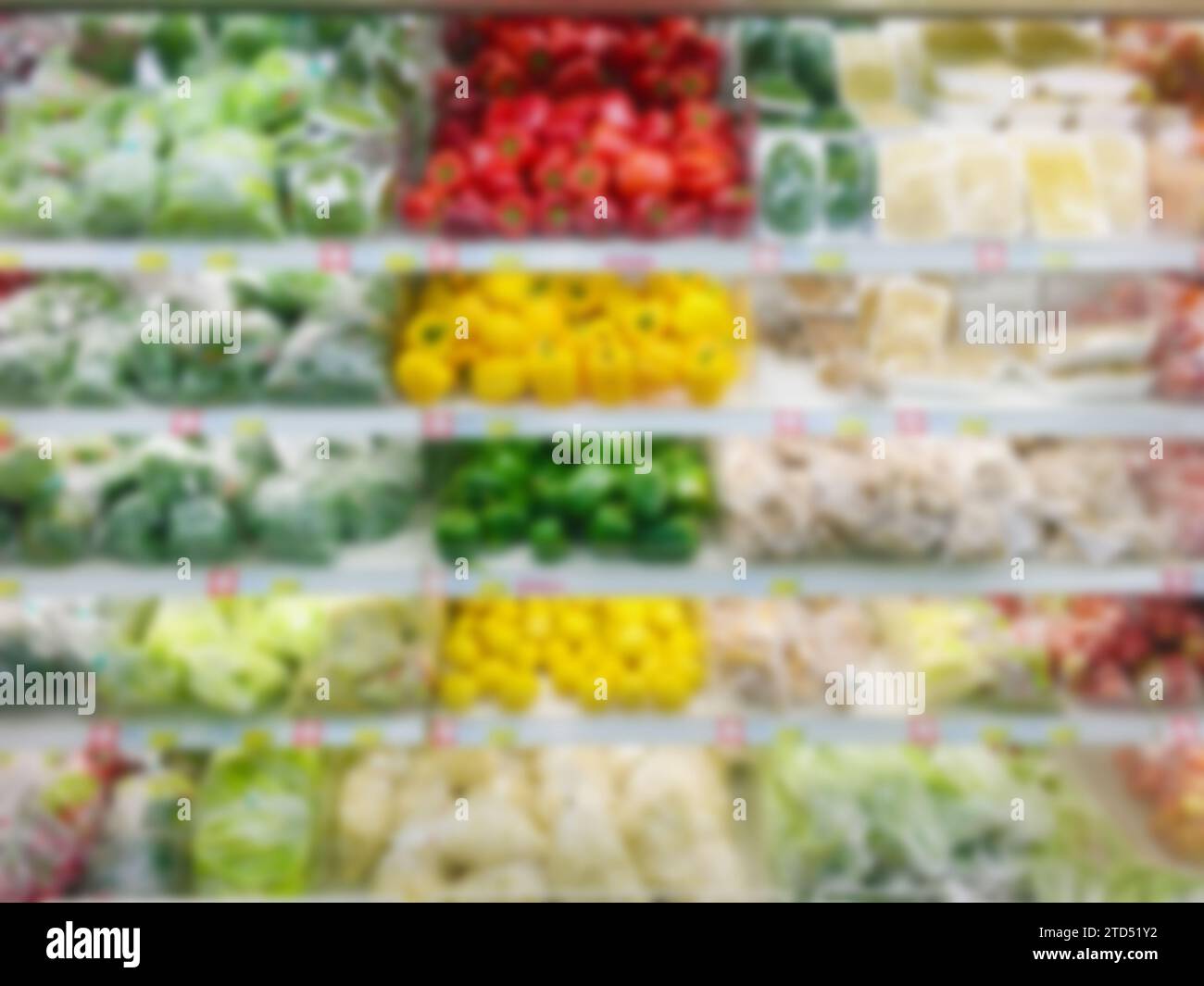 Vegetables on shelf in supermarket blurred background Stock Photo - Alamy
