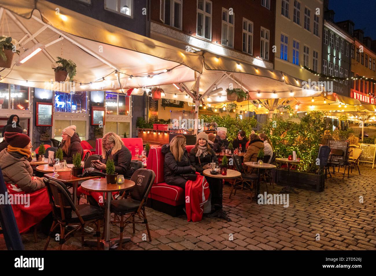 Brave diners keeping warm with provided restaurant blankets and sitting ...