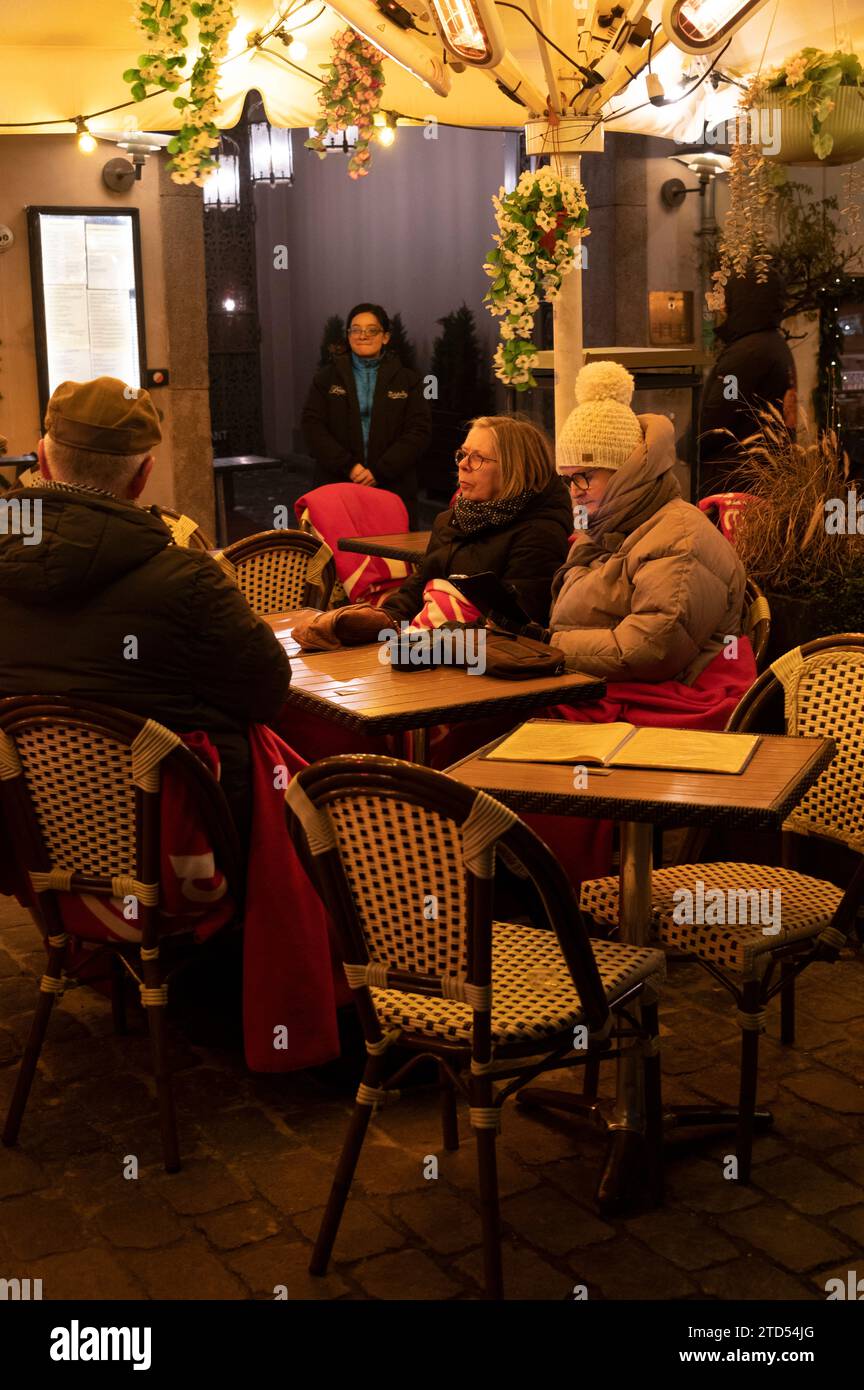 Brave diners keeping warm with provided restaurant blankets and sitting ...