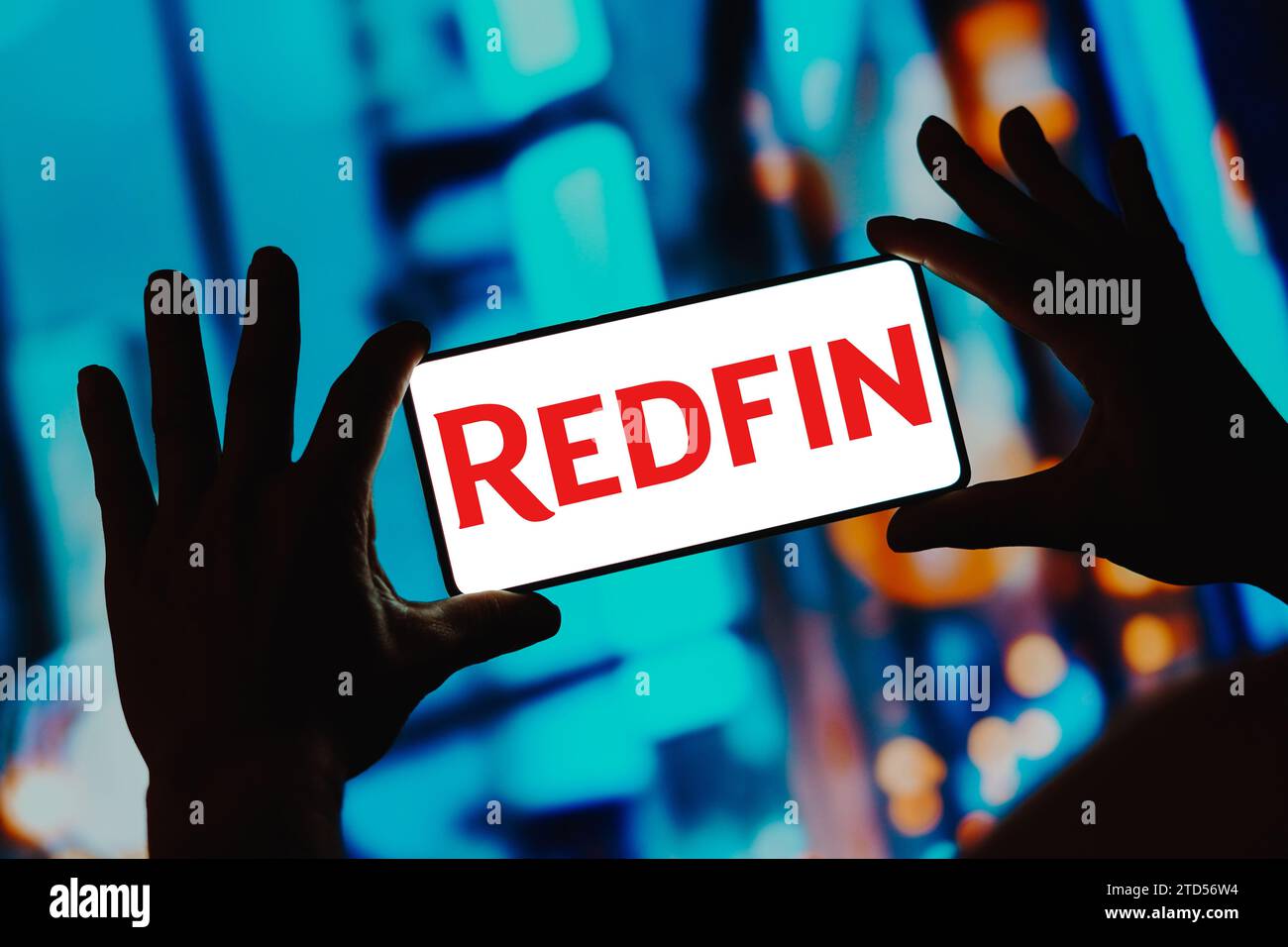 In this photo illustration, the Redfin Corporation logo is displayed on ...