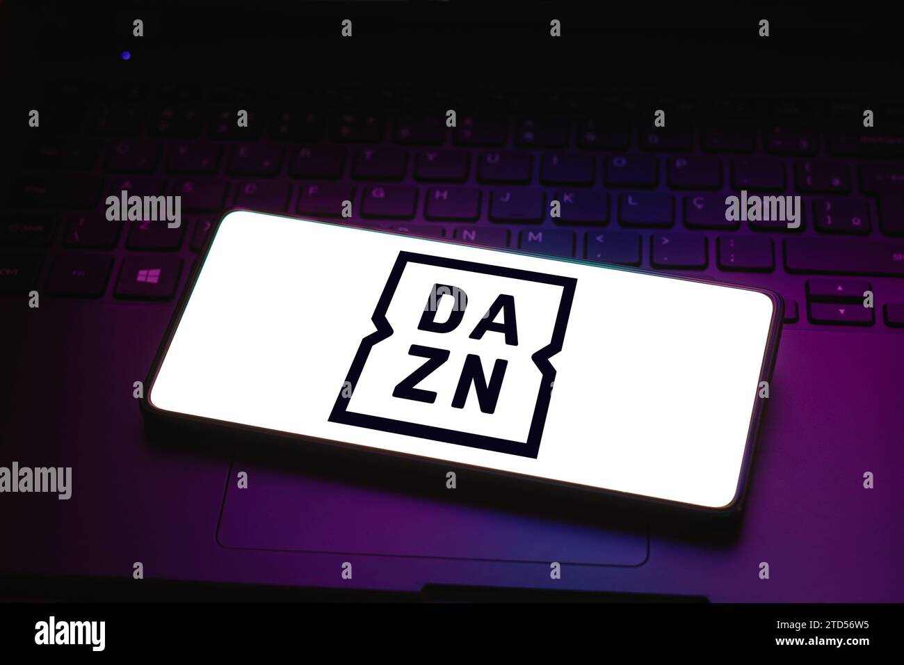 In this photo illustration, the DAZN logo is displayed on a smartphone ...